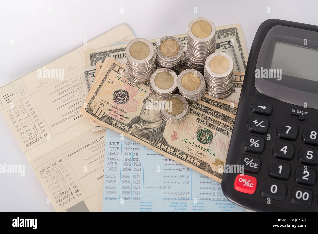 Savings, Piles of coins dollar currency and account book with ...