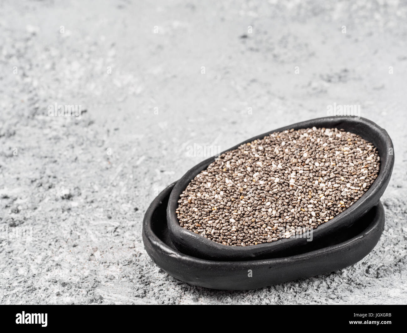 Close up view of chia seeds in trendy plate with copy space. Chia seed ...
