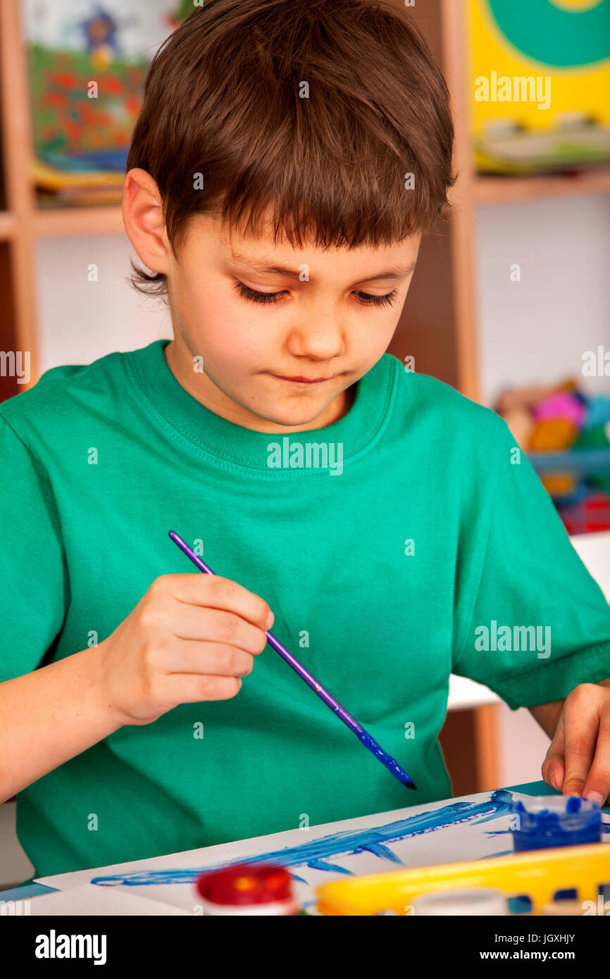 Small students boy painting in art school class Stock Photo - Alamy
