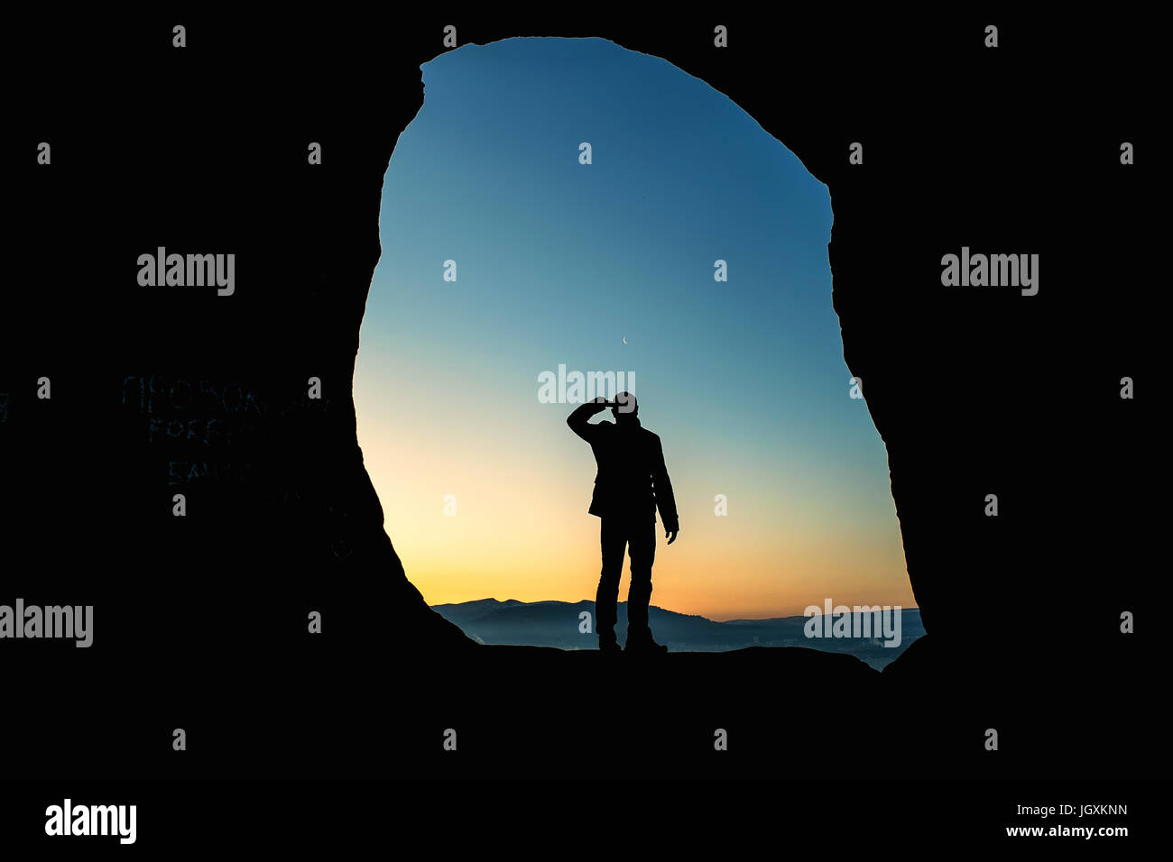 Male traveler in mountains at night Stock Photo - Alamy