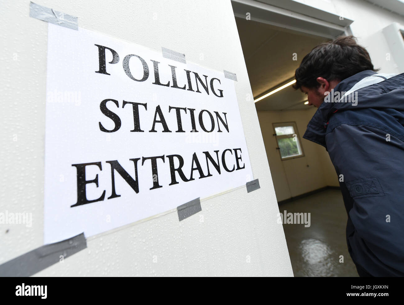 A person arrives to cast their vote at various polling stations around ...