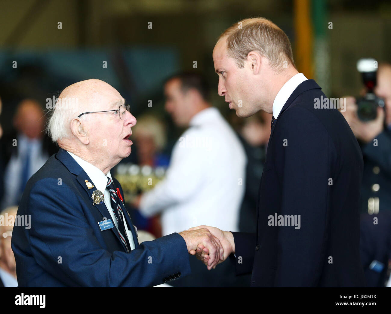 The Duke of Cambridge (right) speaks to Lancaster pilot Rusty Waughman ...