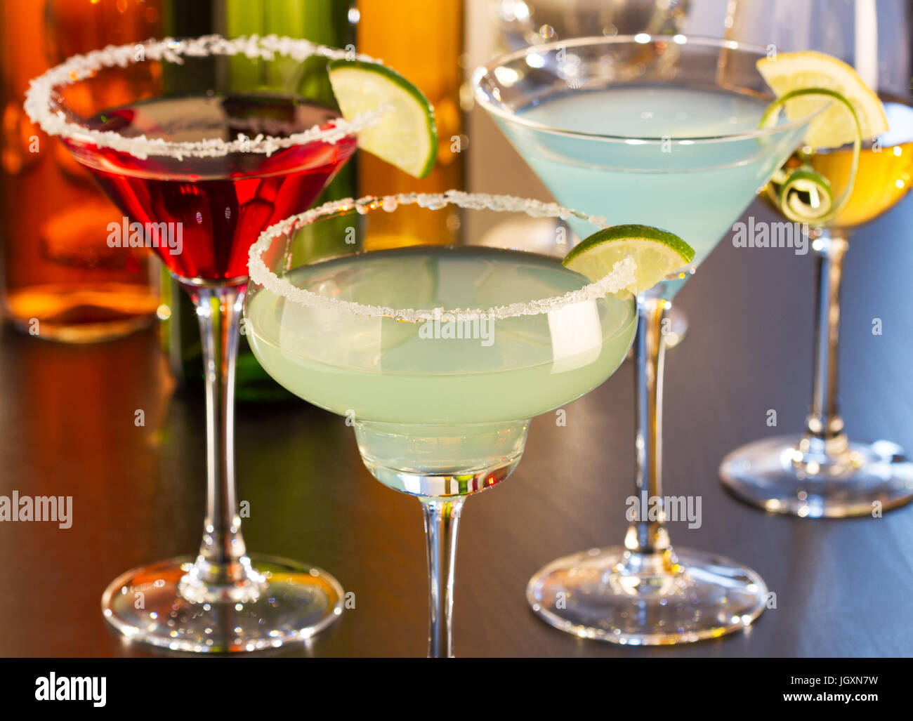 Tropical cocktails garnished with lime slice Stock Photo - Alamy