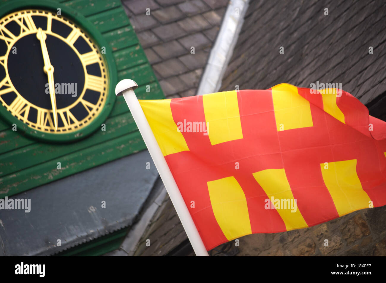 Bellingham Town Hall clock and Northumbrian flag, Northumberland Stock ...