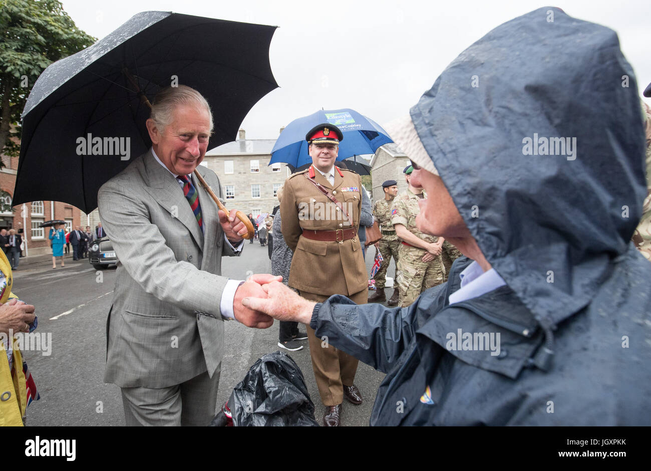 The Prince of Wales greets people during a tour of The Regimental ... The Prince of Wales greets people during a tour of The Regimental ...
