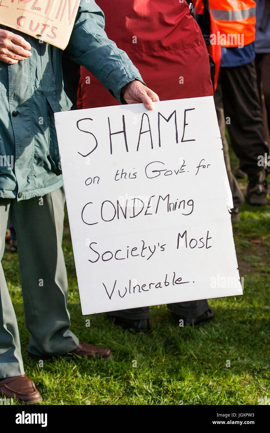 Protester pictured holding a placard at a protest. Public Sector ...