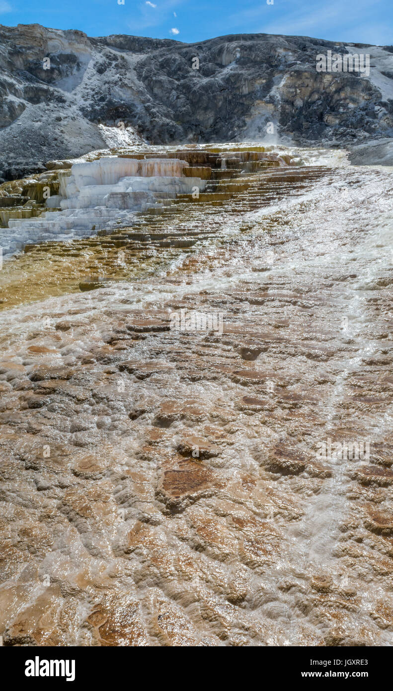 Mineral water streams downhill over mini ledges from a hot spring Stock ...