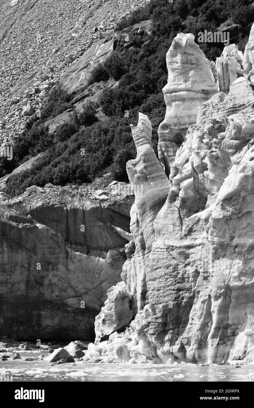 Columns of ice tetter at the leading edge of a glacier Stock Photo - Alamy