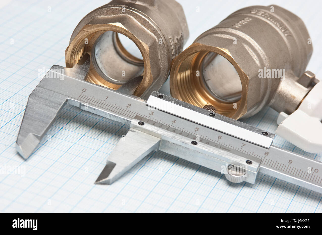 water inlet valve on a background of graph paper Stock Photo - Alamy