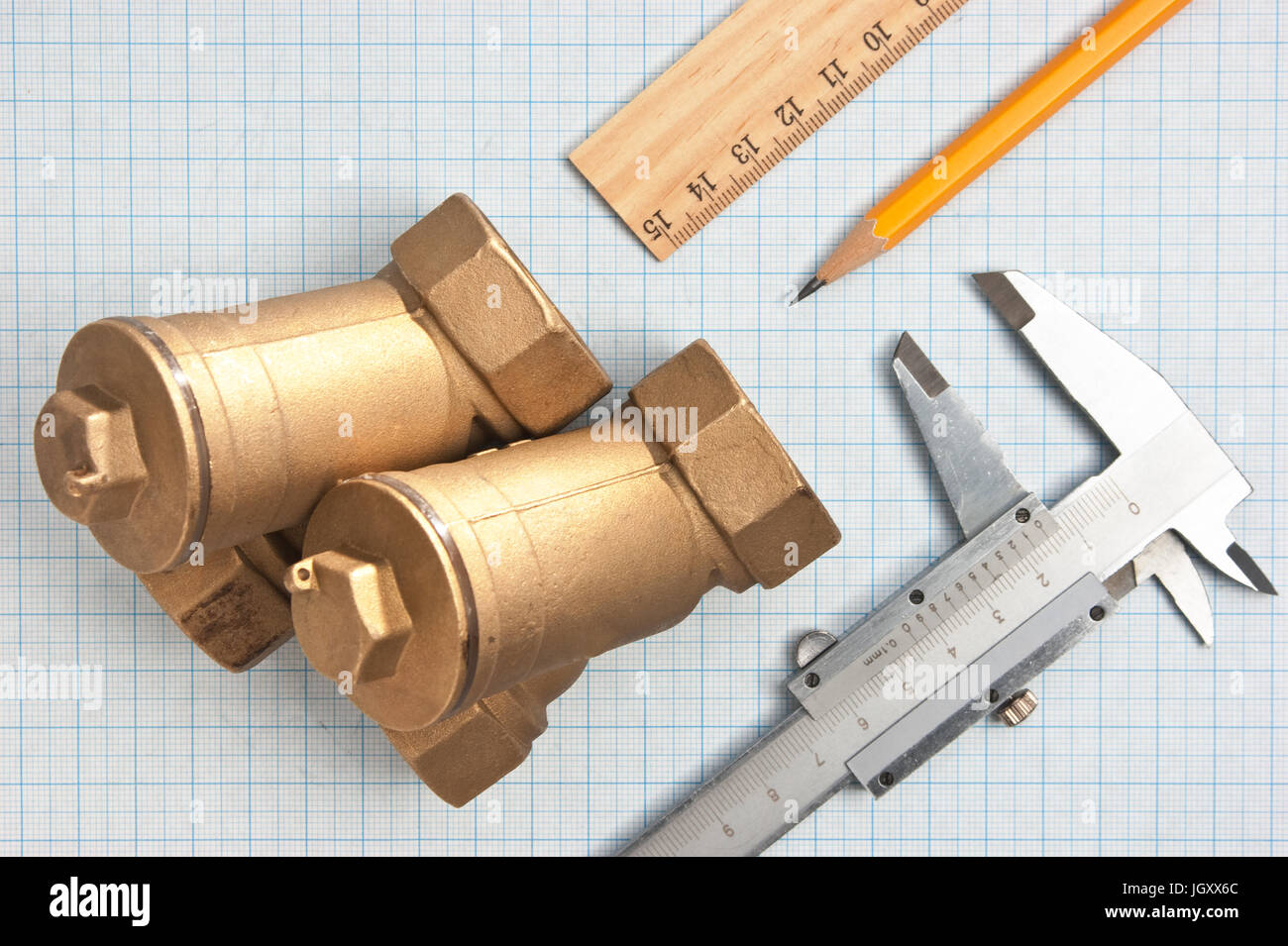 water inlet valve on a background of graph paper Stock Photo - Alamy
