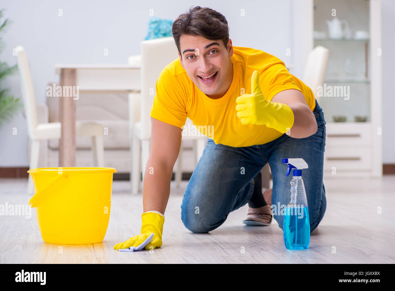 Young man doing chores at home Stock Photo - Alamy