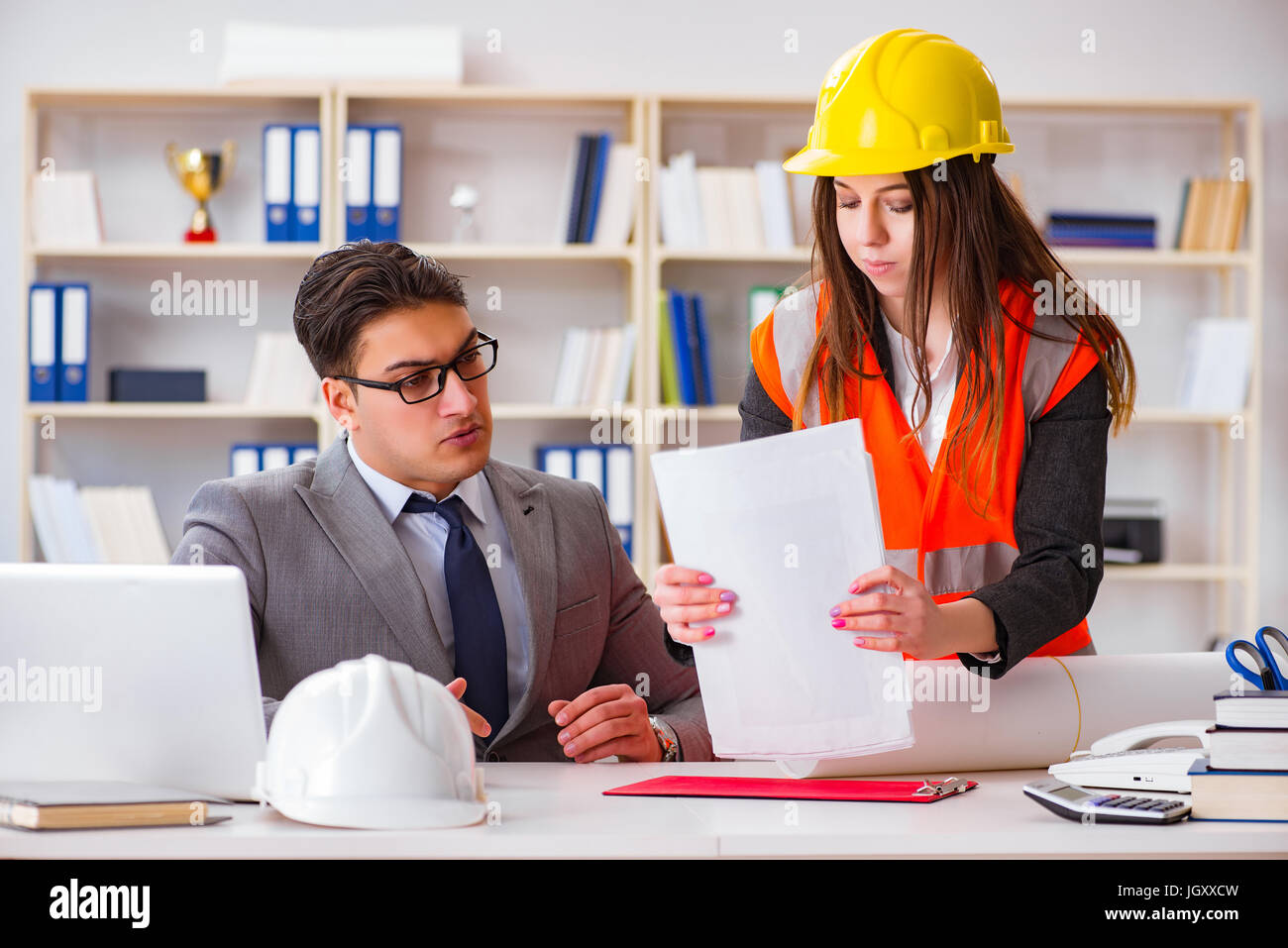 Construction foreman supervisor reviewing drawings Stock Photo - Alamy