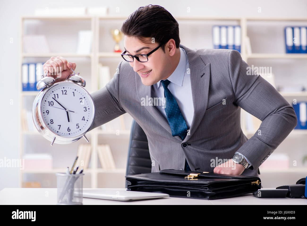 Businessman rushing in the office Stock Photo - Alamy