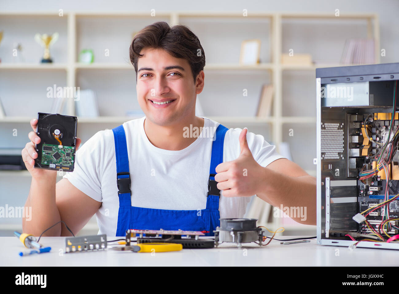 Computer repairman repairing desktop computer Stock Photo - Alamy