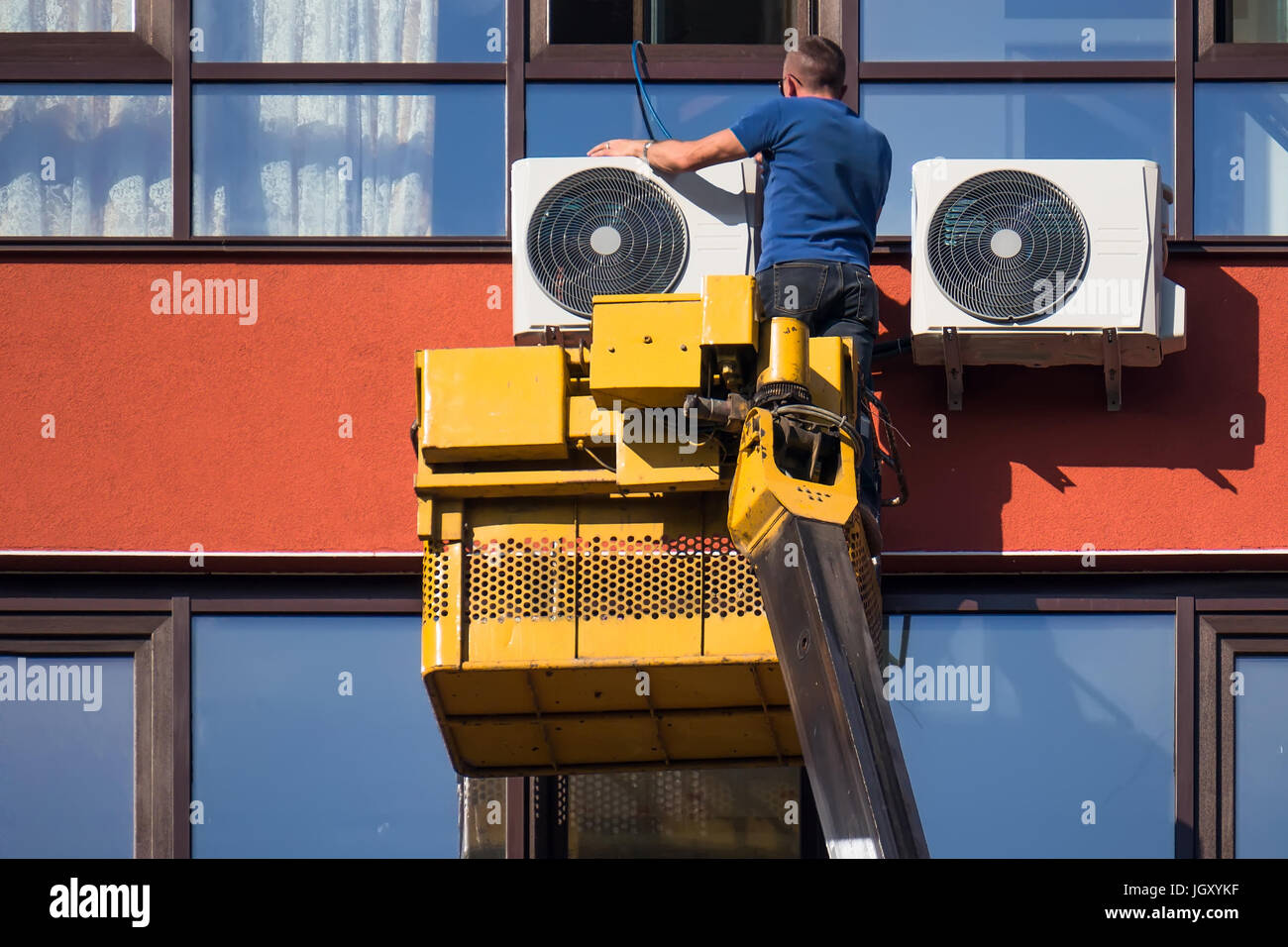 Installation of outdoor air conditioning on a tall building on the ...