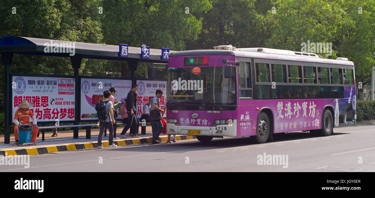 Students boarding single-decker bus on route 178 on Ren'ai Road, while ...