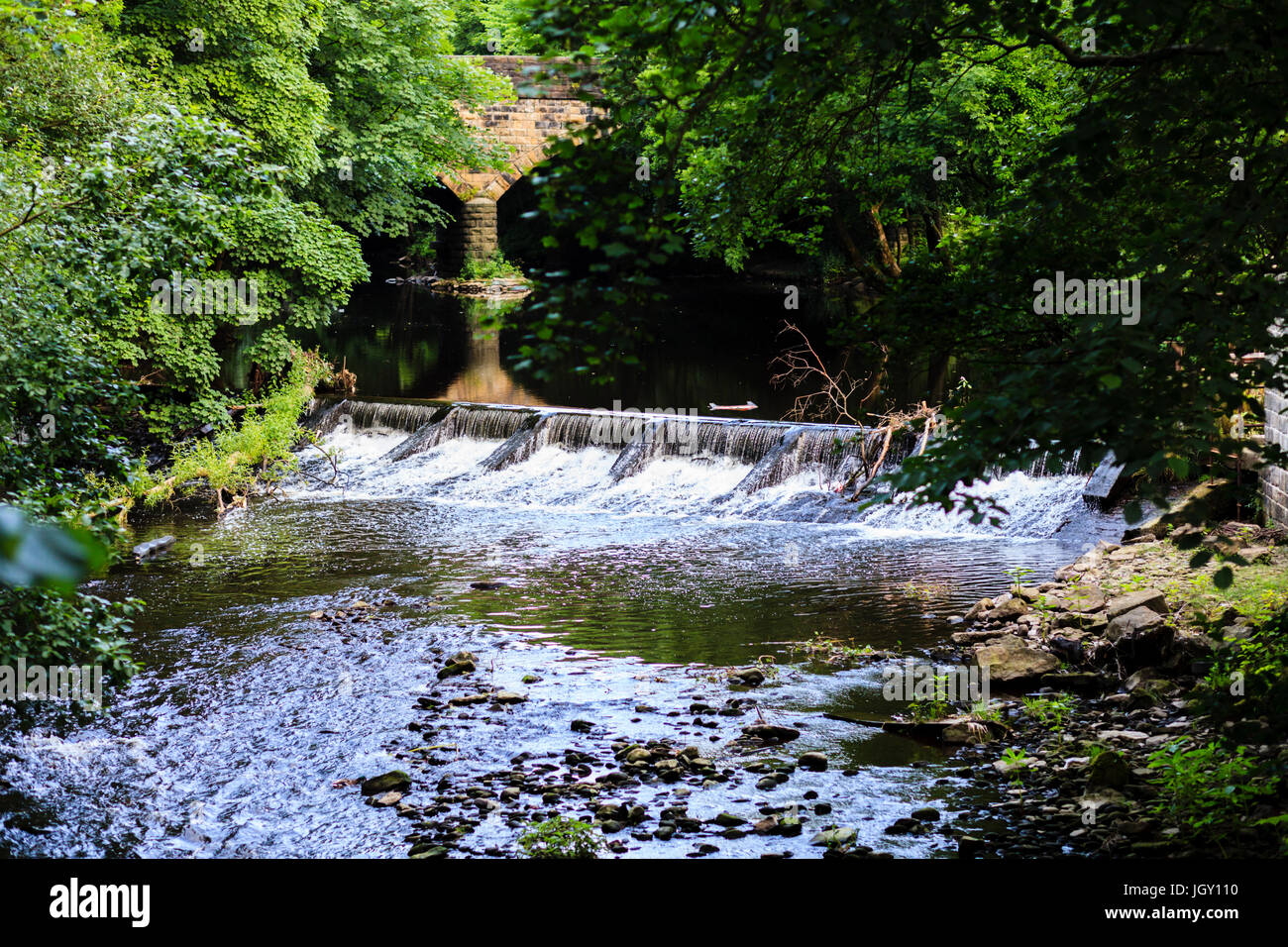 A weir on the River Calder near Hebden Bridge Stock Photo - Alamy