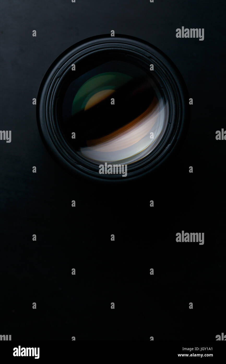 Front view of photo lens on black background Stock Photo - Alamy