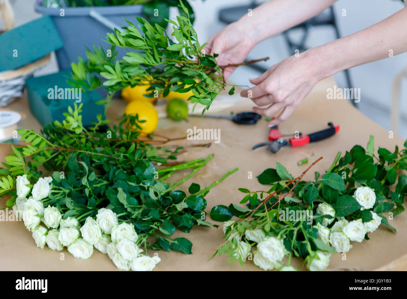 Photos of flowers, florist at work, secateurs on table Stock Photo - Alamy
