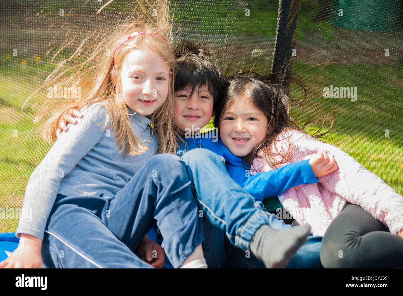 Portrait of friends looking at camera smiling Stock Photo - Alamy