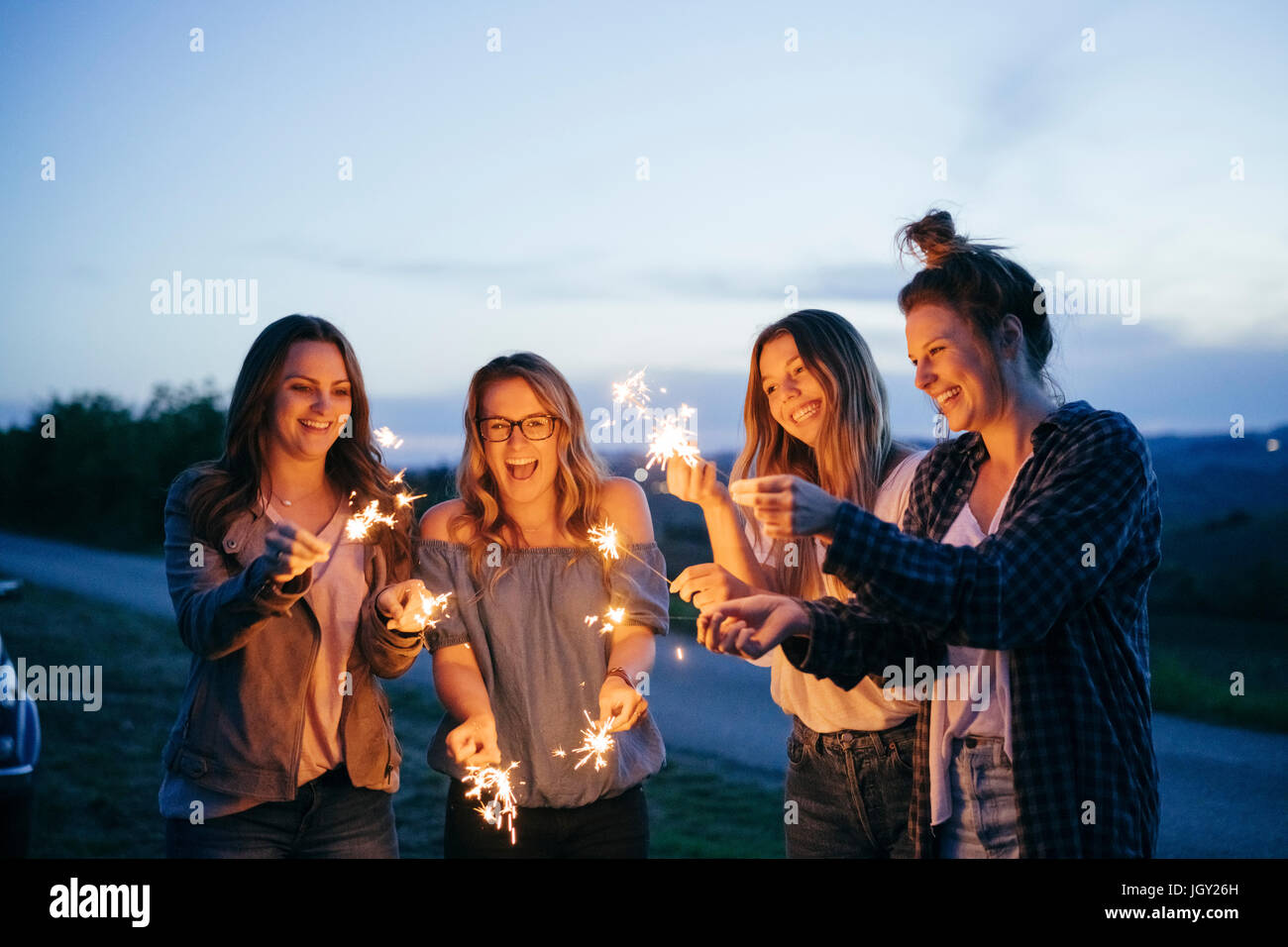 Woman playing sparklers hi-res stock photography and images - Alamy