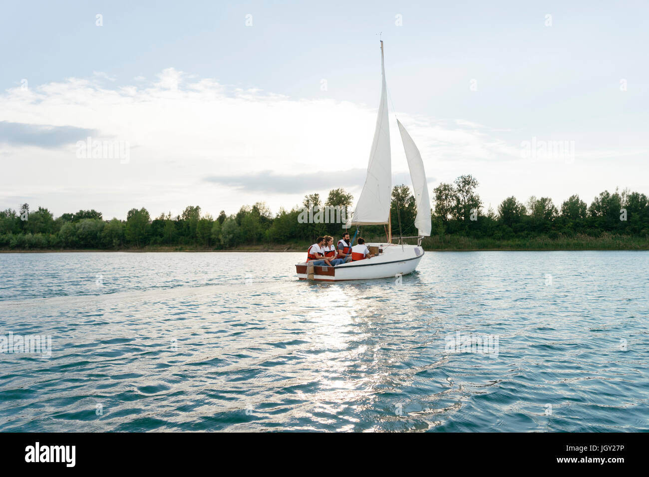 Group of people on sailing boat on lake, Signa, Tuscany, Italy Stock ...