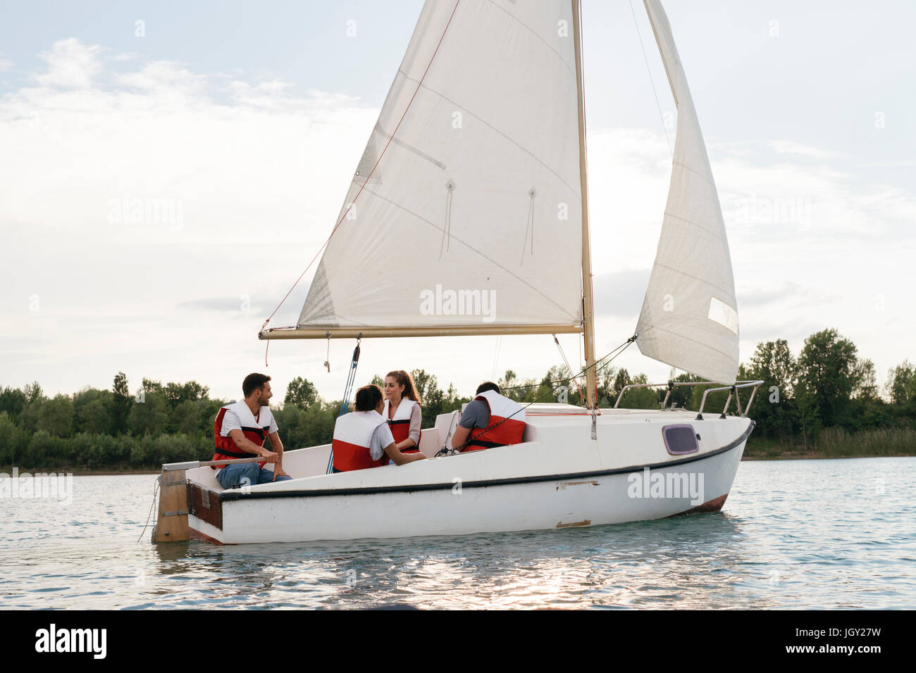 Group of people on sailing boat on lake, Signa, Tuscany, Italy Stock ...