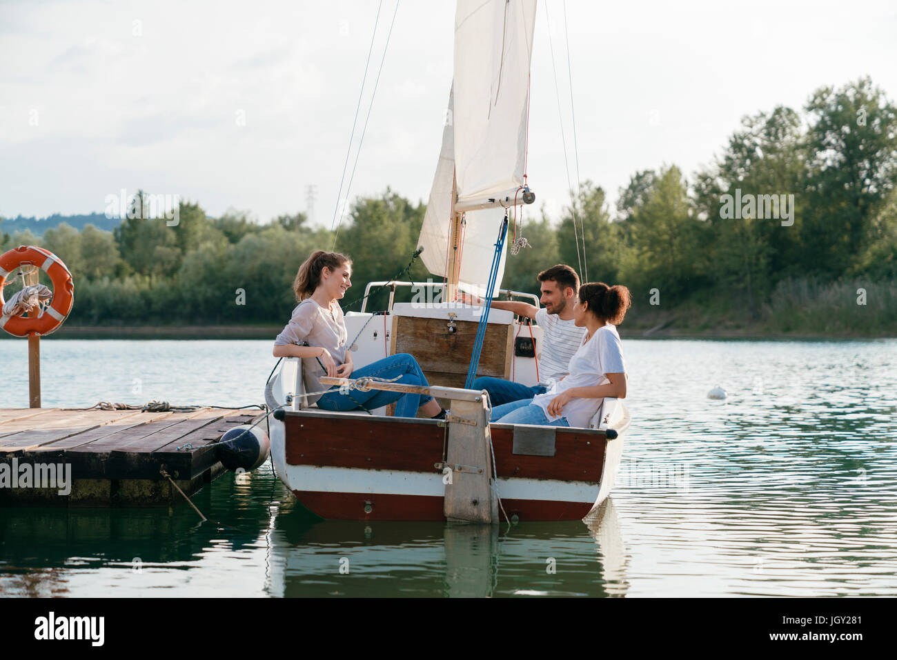 Young woman relaxing on sailboat hi-res stock photography and images ...