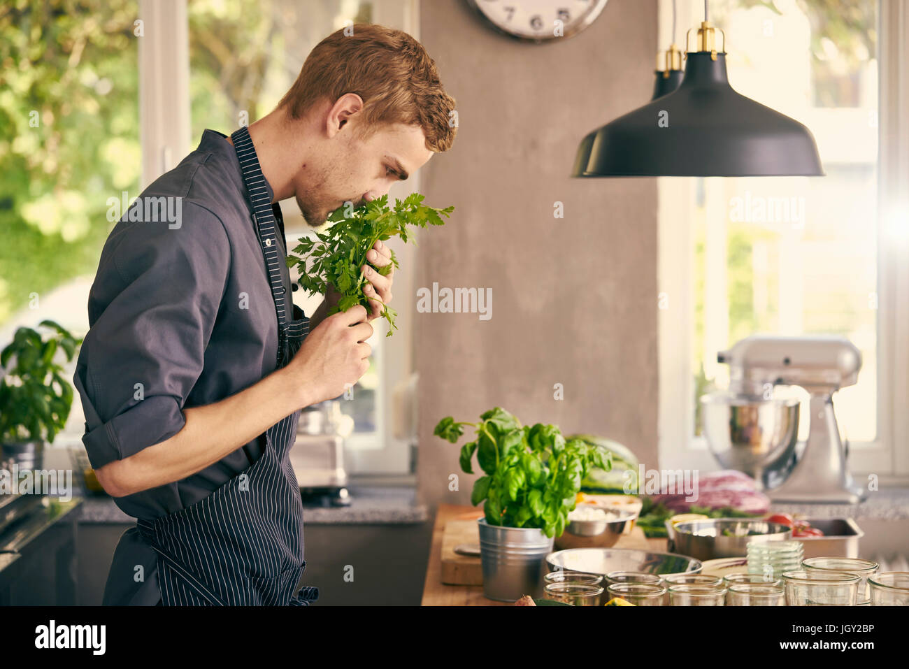 Chef smelling fresh herbs Stock Photo - Alamy