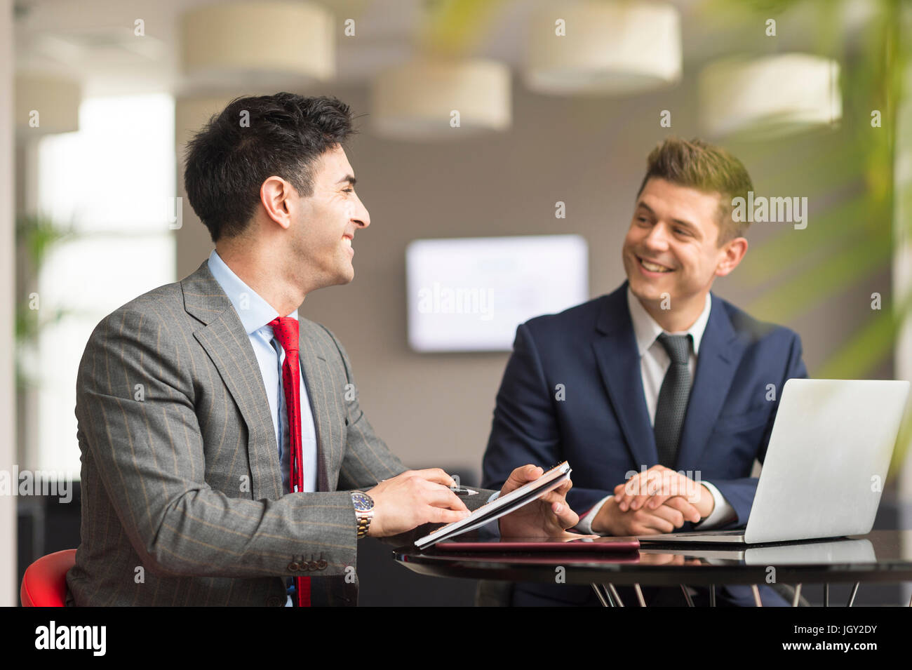 Two businessmen meeting in boardroom Stock Photo - Alamy