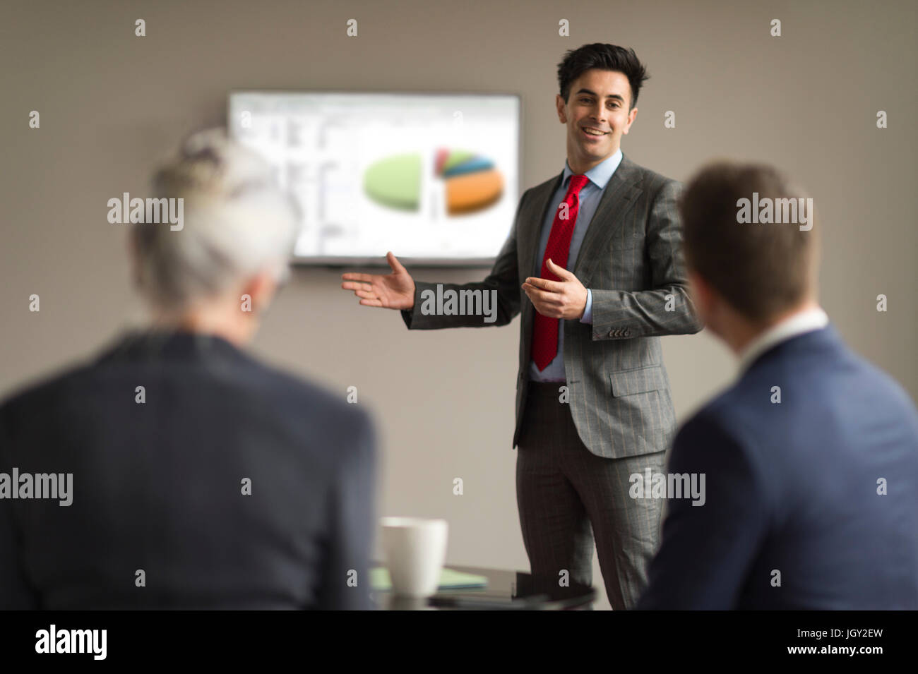 Over shoulder view of businessman making office presentation to ...
