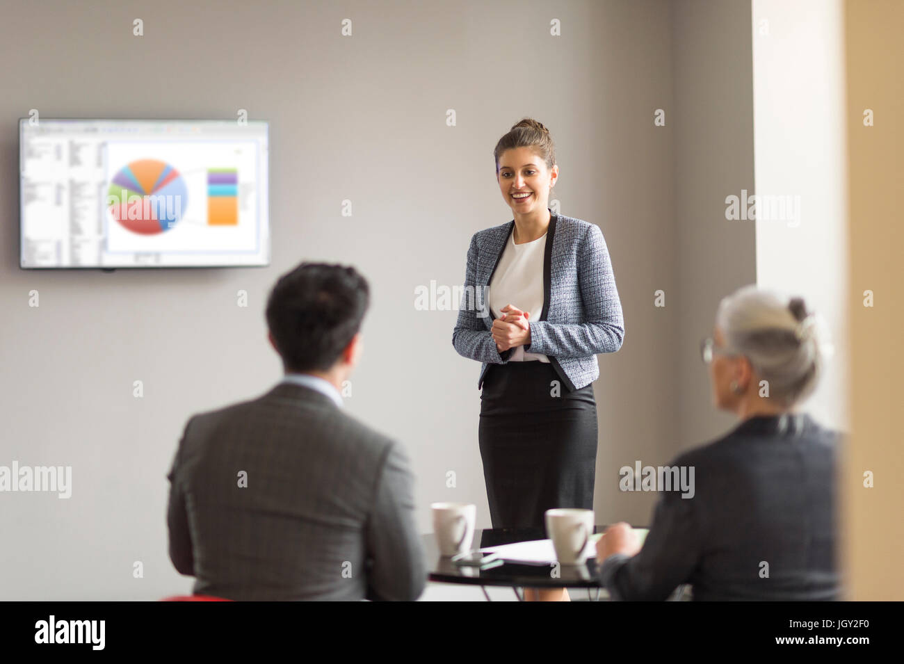 Young businesswoman doing office presentation Stock Photo - Alamy
