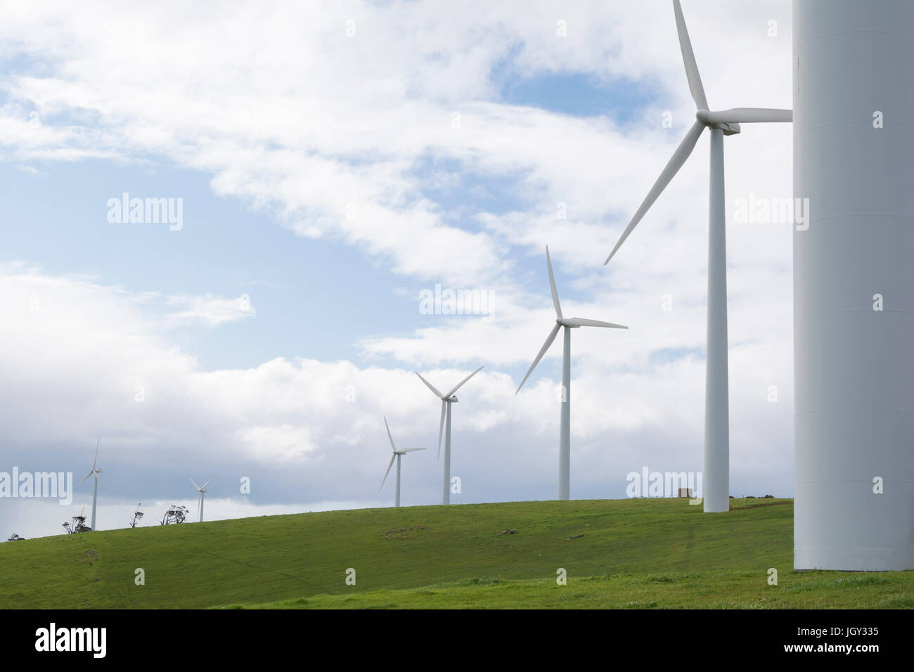 Row of windmills busily generating electricity on the windmill farm in ...