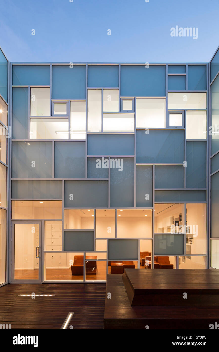 Dusk elevation of geometric courtyard facade. Marubi National Museum of ...