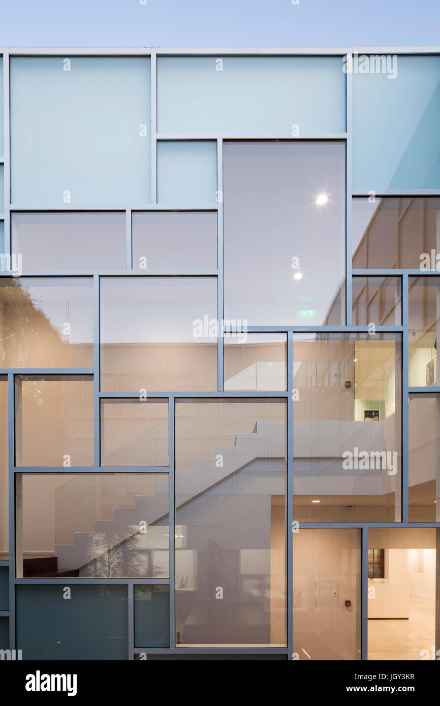 Geometric facade pattern with windows and view through. Marubi National ...