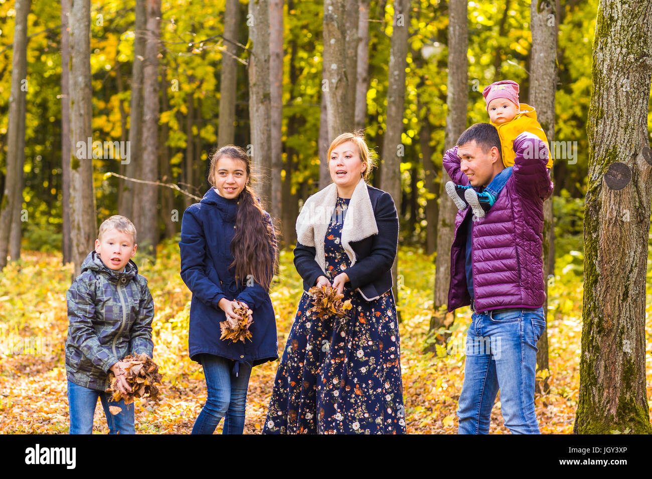 Family, autumn, happiness and people concept - mother, father, son and ...