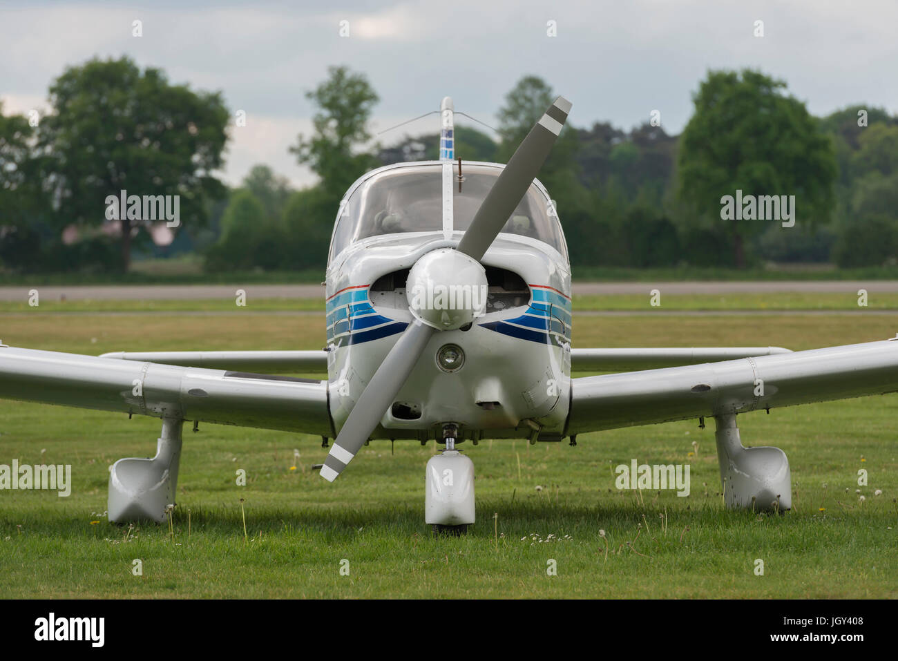 Front view of a recreational single-engine white propeller plane on a ...