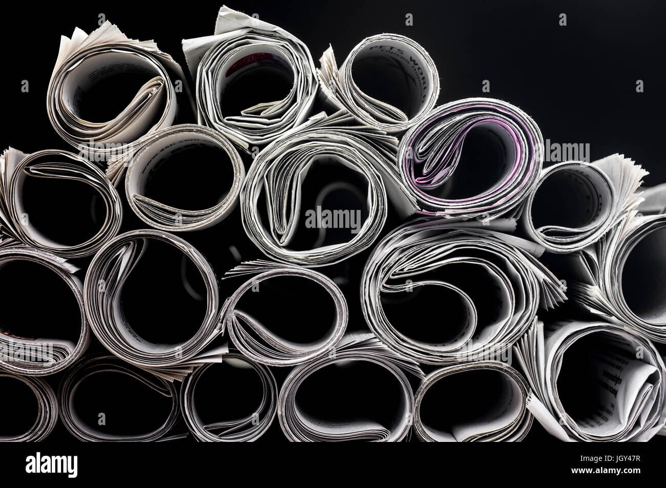 Rolled up newspapers hi-res stock photography and images - Alamy