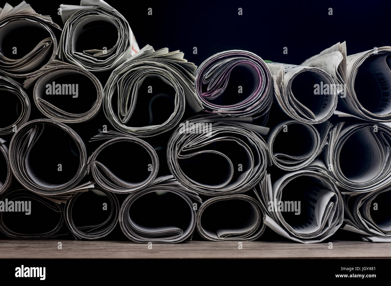 Rolled up newspapers hi-res stock photography and images - Alamy
