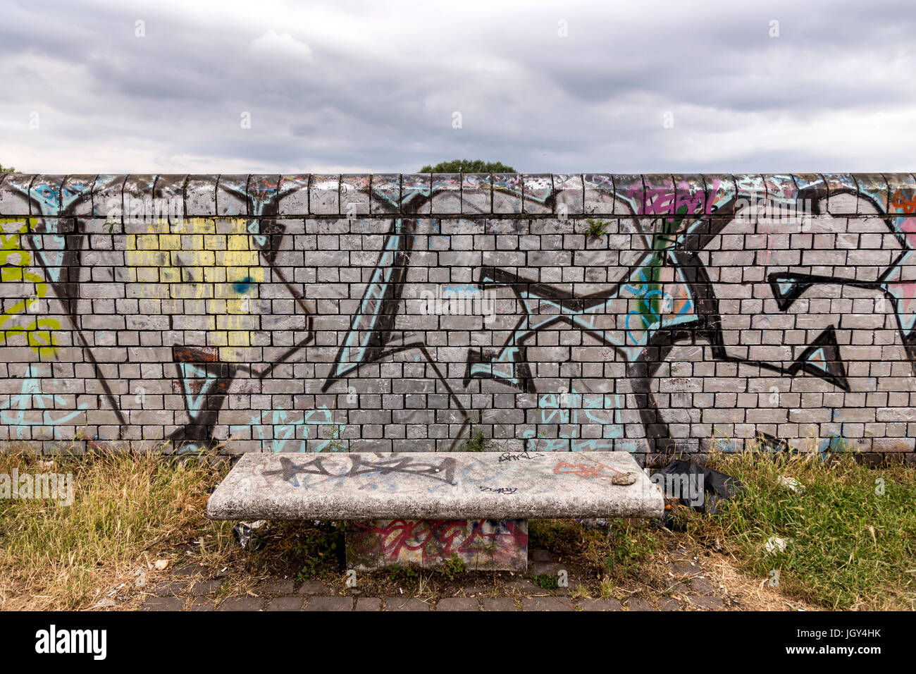 City bench with youth graffiti Stock Photo - Alamy