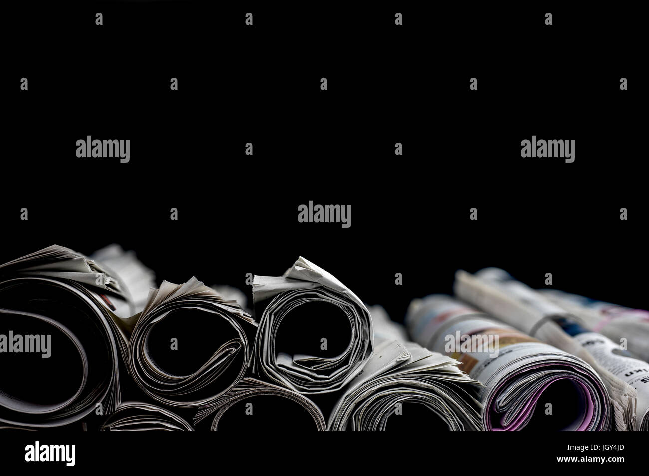 Rolled up newspapers hi-res stock photography and images - Alamy