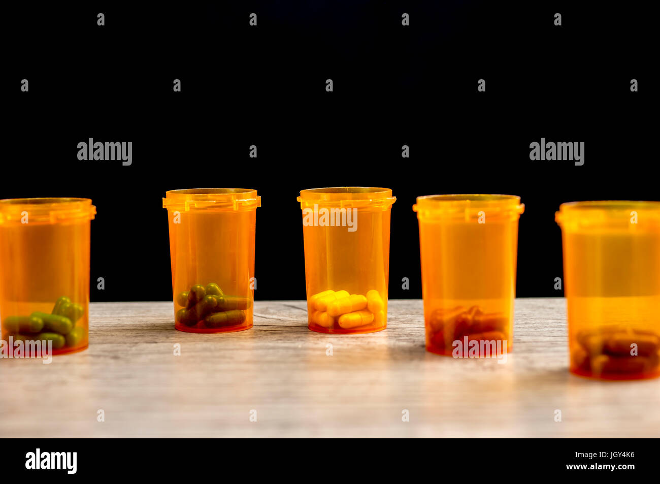 Colorful prescription pills inside amber pill bottles close up Stock ...