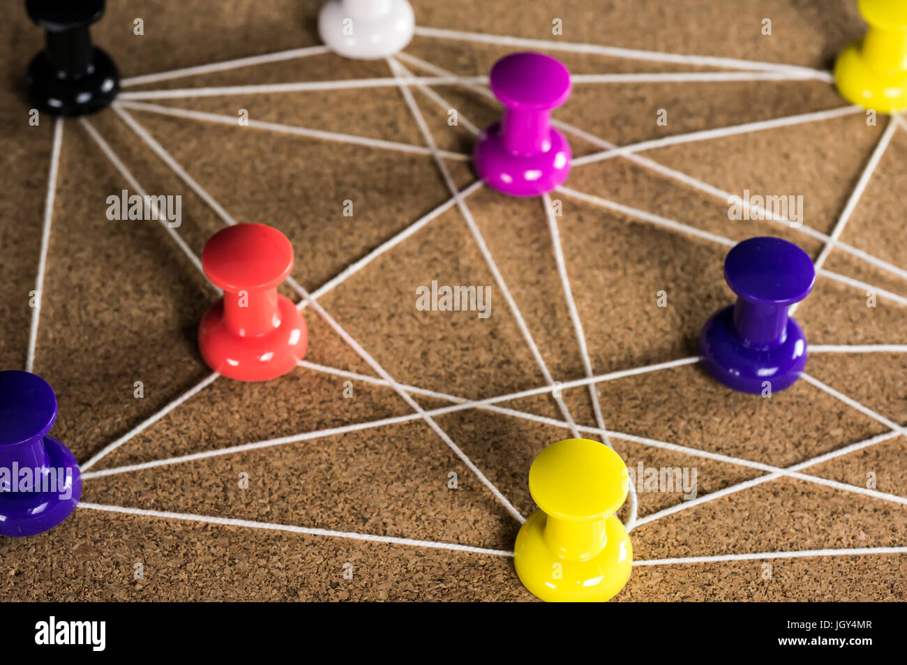 String placed on colorful pins forming a network Stock Photo - Alamy