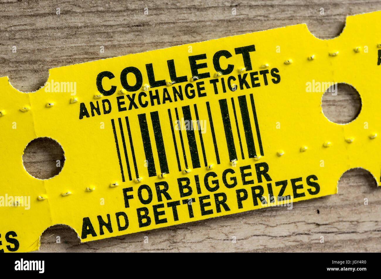 Macro shot of a yellow arcade prize ticket Stock Photo - Alamy