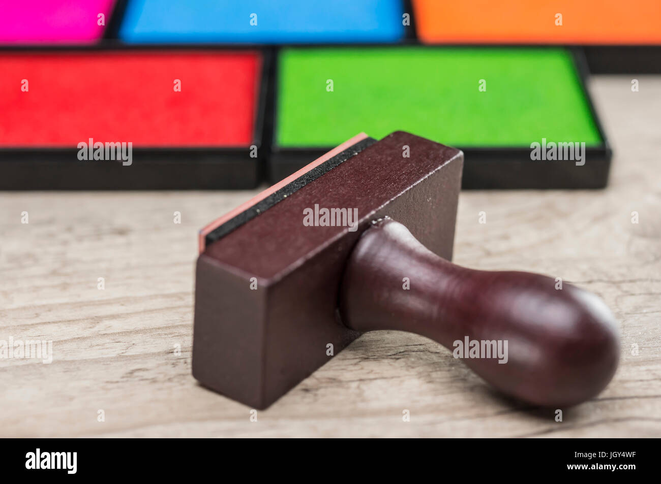 Close up shot of rubber stamp and multiple colors of ink boxes Stock ...