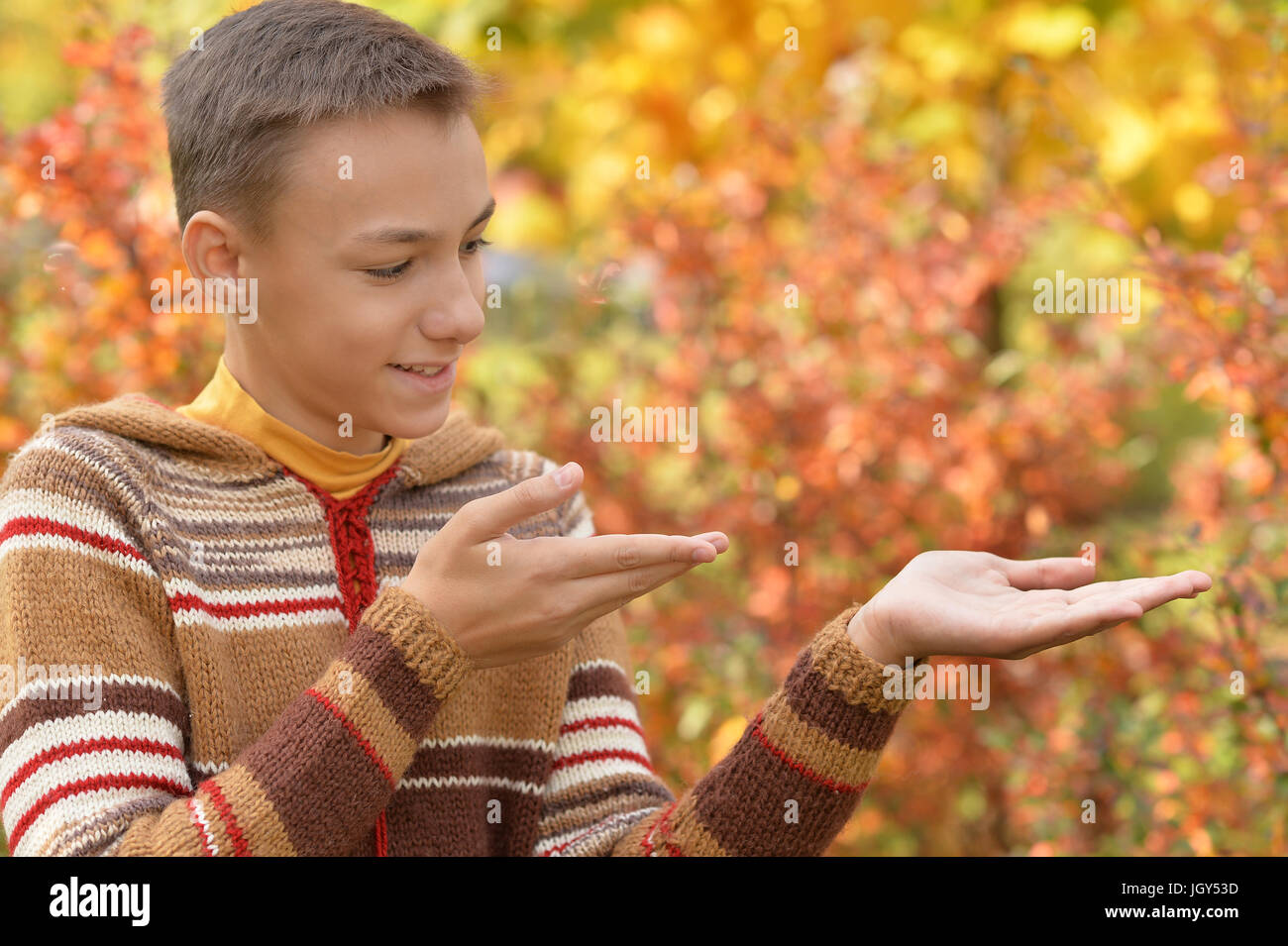 boy showing something Stock Photo - Alamy