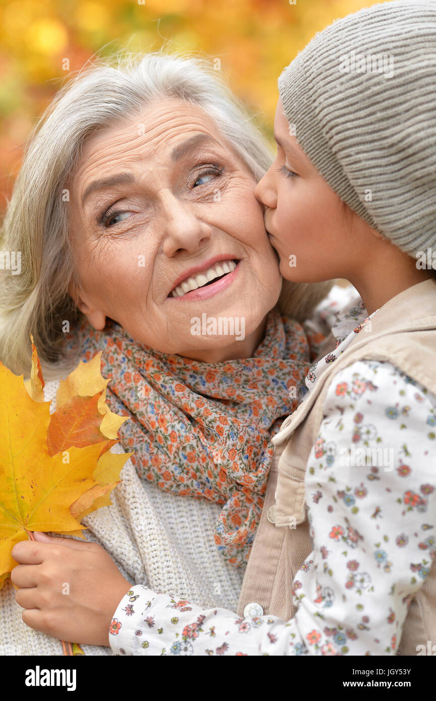 Woman kissing cute smiling hi-res stock photography and images - Alamy