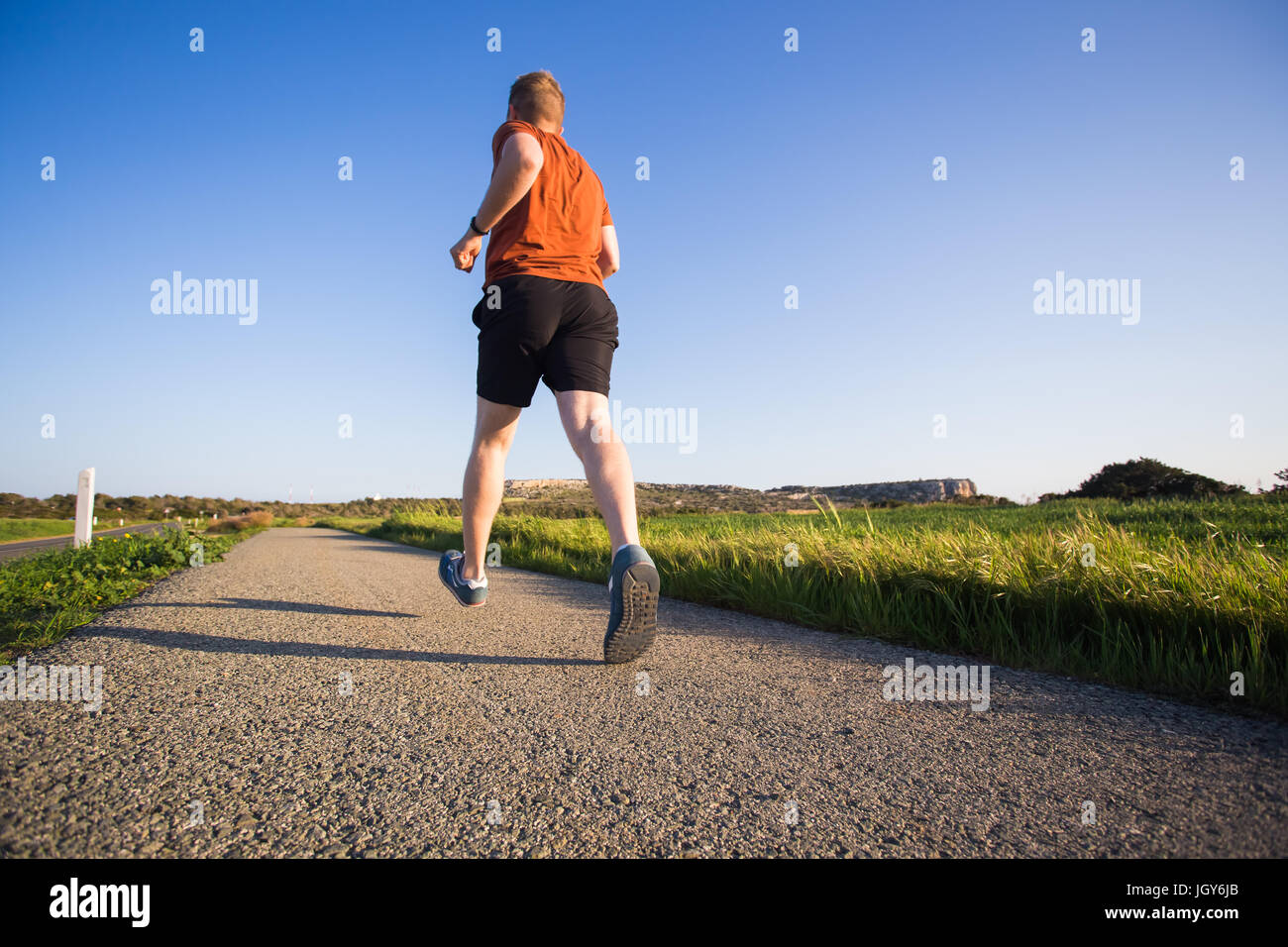 Man running outdoor sprinting for success. Male fitness runner sport ...