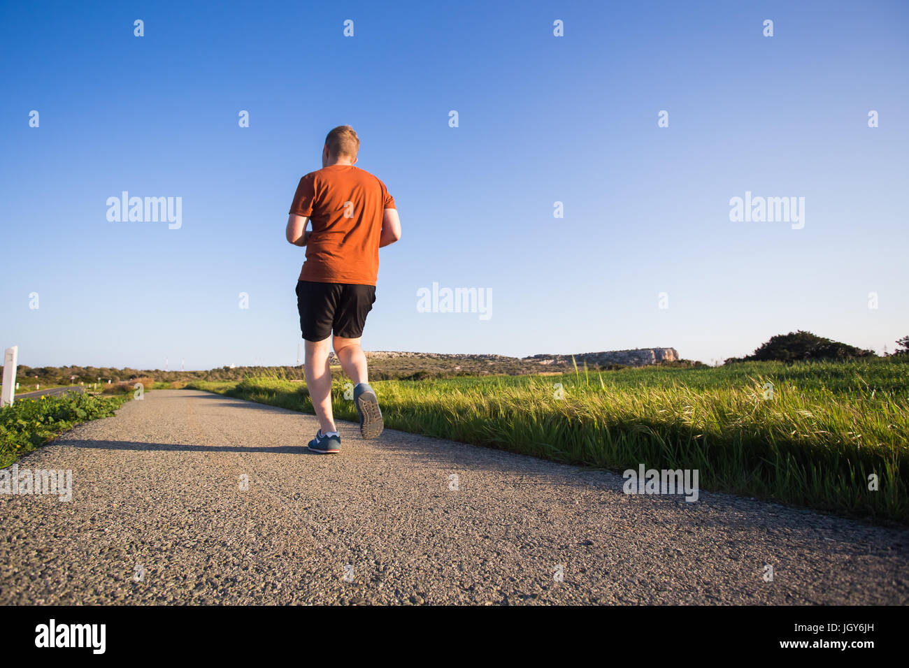 Man running outdoor sprinting for success. Male fitness runner sport ...