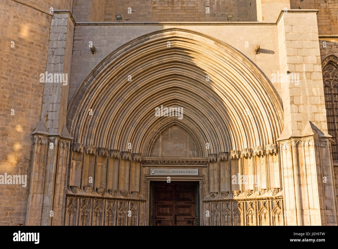 The gothic portico in south facade of Santa Maria cathedral. Gerona ...